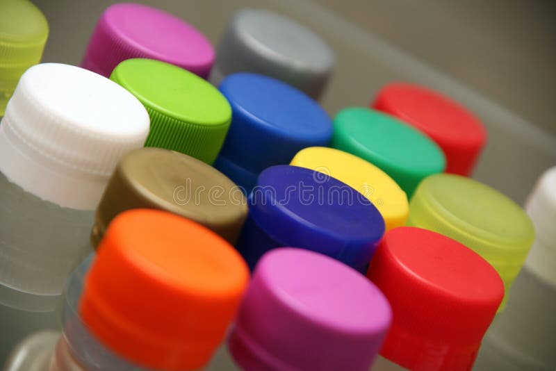 Colored Plastic Bottle Caps Stock Photo - Image of isolated, orange ...