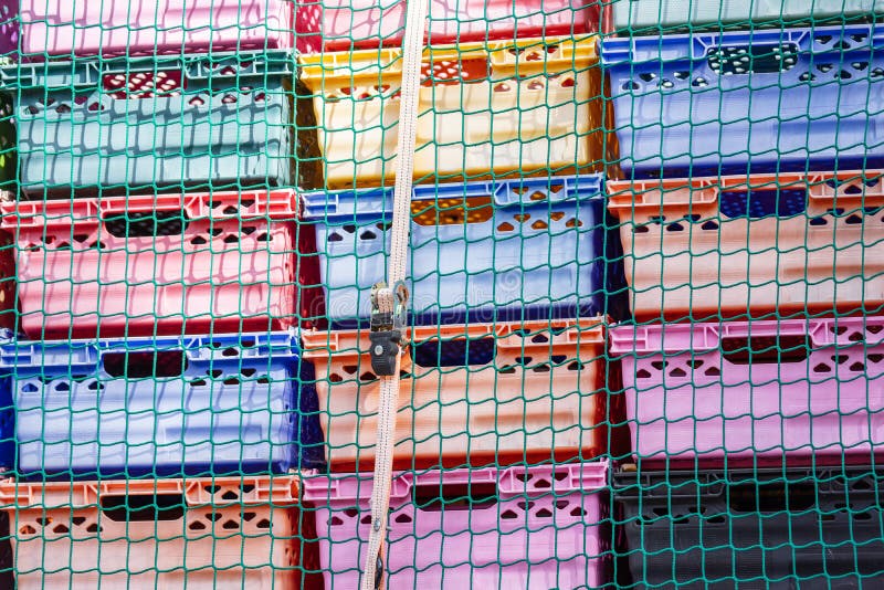 Colored Plastic Boxes for Transportation on a Lorry Fixed by Truck Net ...