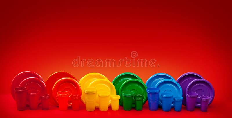 Colored Plastic Plates On Red Background Stock Image - Image of ...