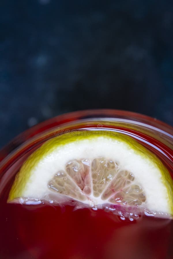 Colored Lemonade with Lemon on Dark Surface Stock Photo - Image of ...