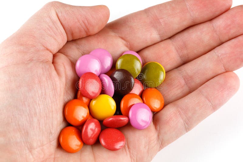 Colored Round Chocolates or Chewing Gum in Hand Stock Image - Image of ...