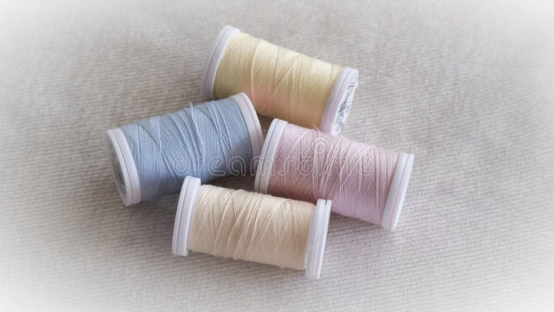 Colored Sewing Thread Reels on Fabric Stock Photo - Image of reel ...