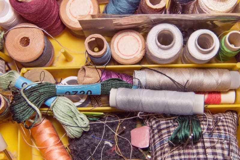 Colored Skeins of Threads and Needles in a Box Stock Photo - Image of ...