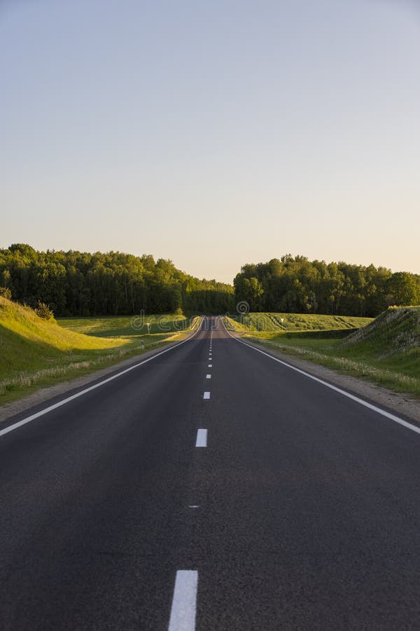 A Colored Sky at Sunset and an Empty Highway Stock Photo - Image of ...
