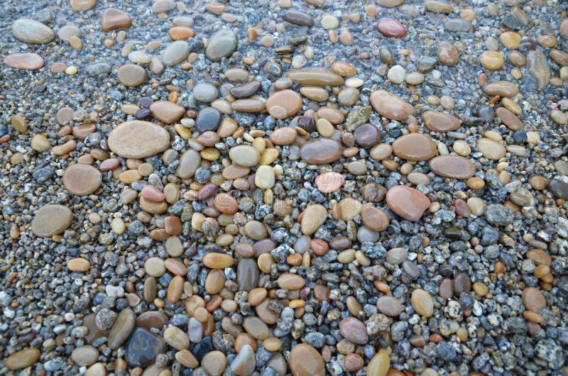 Row of Colored Smooth Stones Polished by Baikal Lake. Focus on First ...