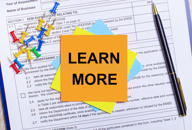 Colored Stickers with the Text LEARN MORE, Colorful Paper Fasteners and ...