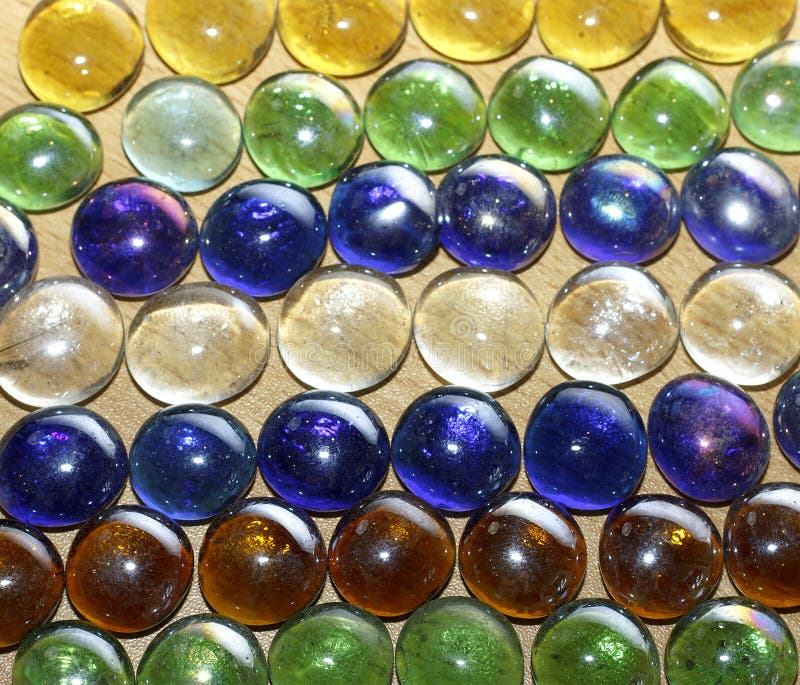 Colored Stones on a Wooden Table Stock Photo - Image of table, yellow ...