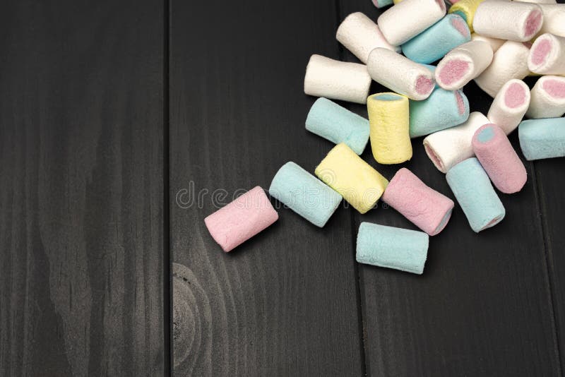Colored Sweets for Children Over a Black Wooden Background Stock Photo ...