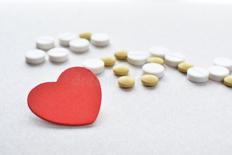 Colored Tablets with Red Heart Stock Photo - Image of color, healthcare ...