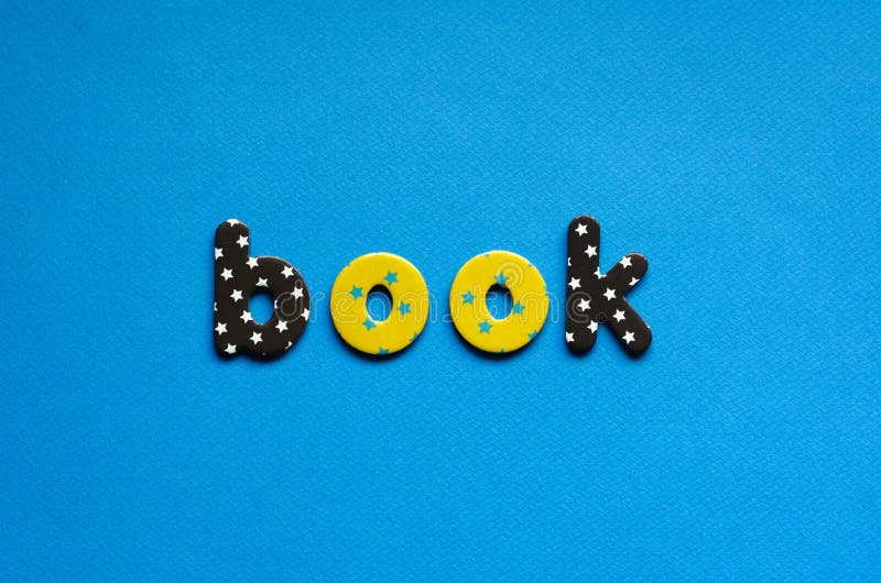 Colored Text Book on Blue Paper Background. Stock Photo - Image of book ...