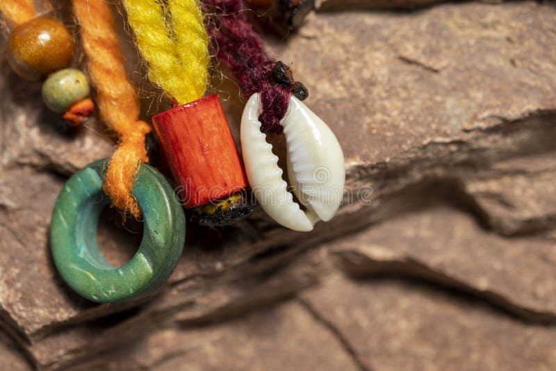 Colored Threads and Colored Beads at the Ends. Isolated on Stone ...