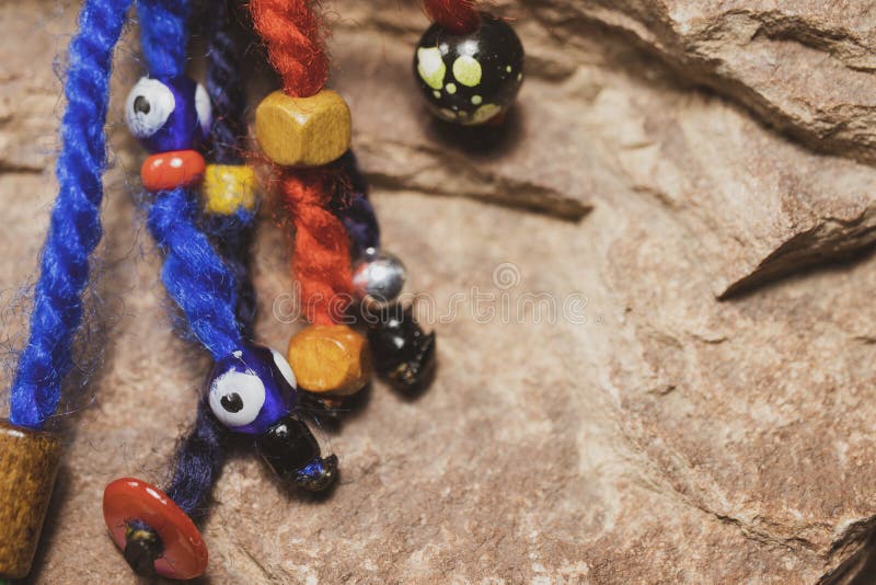 Colored Threads and Colored Beads at the Ends. Isolated on Stone ...