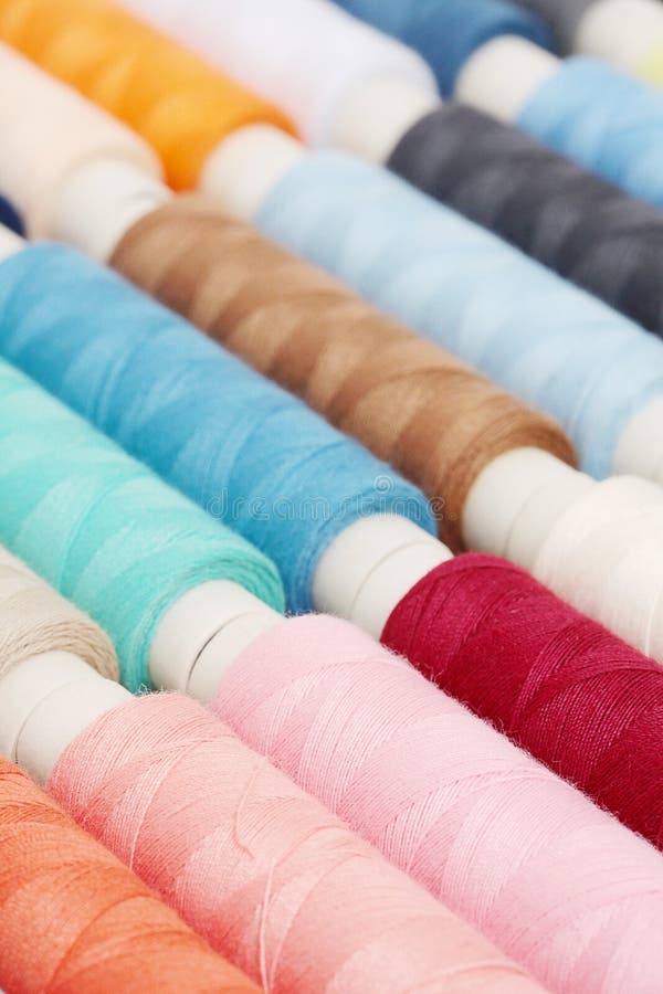 Colored threads for sewing stock image. Image of buttons - 22544991