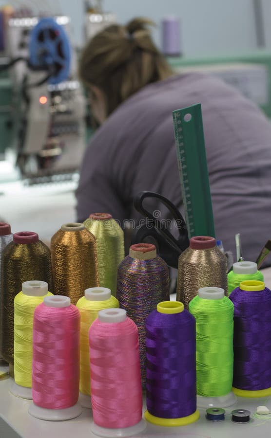 Colored Threads are on the Table for Embroidery on a Modern Embroidery ...