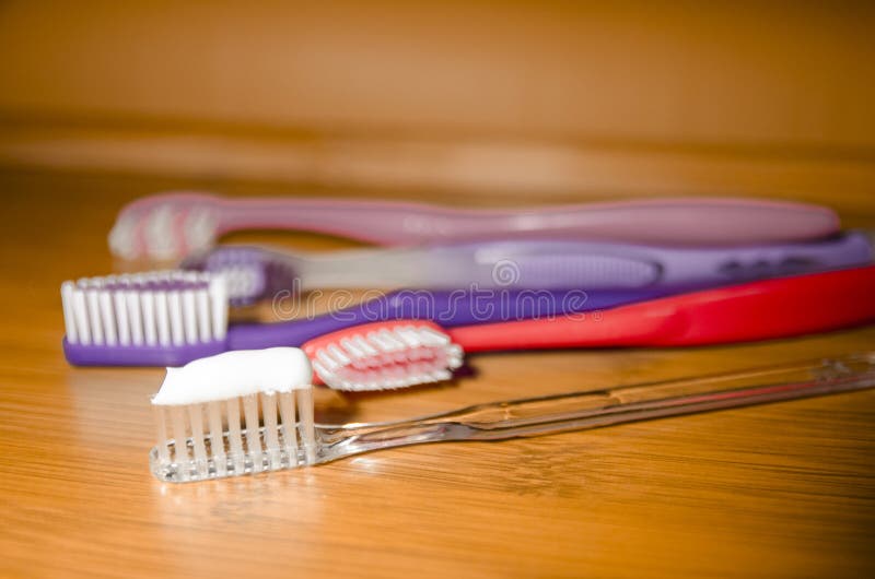 Colored Toothbrushes on the Wooden Table Stock Image - Image of dental ...