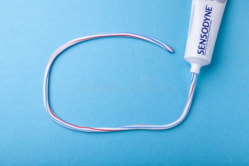 Colored Toothpaste Squeezed Out in Frame Shape from Tube on Blue Stock ...