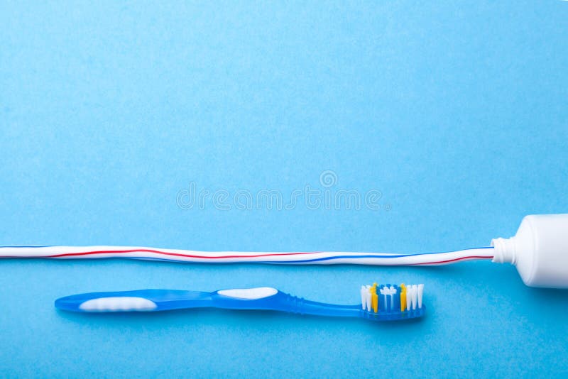 Colored Toothpaste Squeezed Out Line from Tube on Blue Stock Photo ...