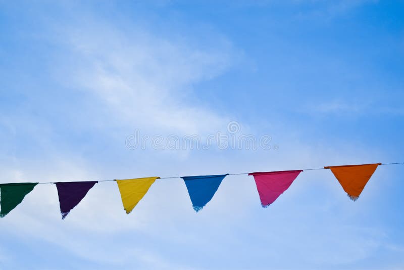 Colored Triangular Flags on Bright Blue Sky Background Stock Photo ...