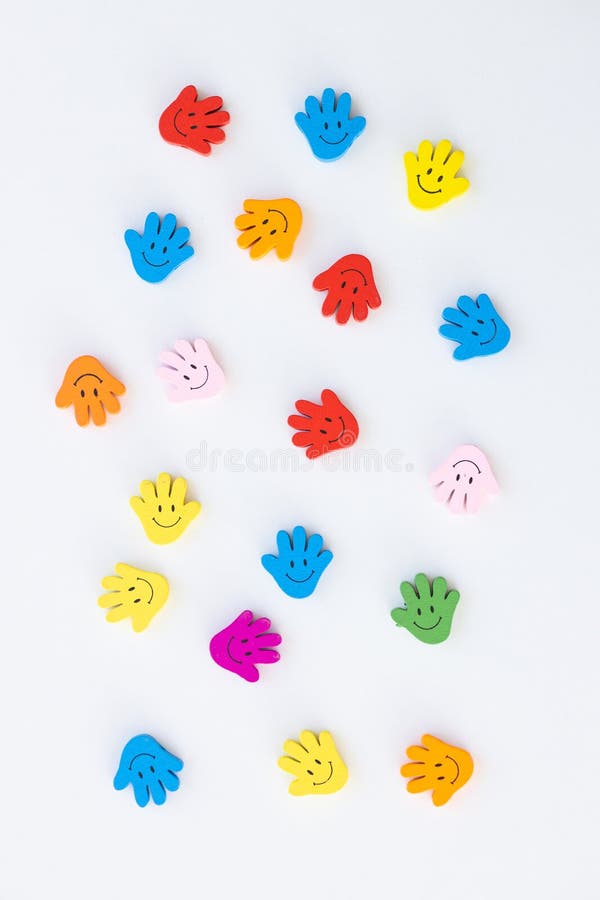 Colored Wooden Figures in the Form Hand with Smiles on a White ...