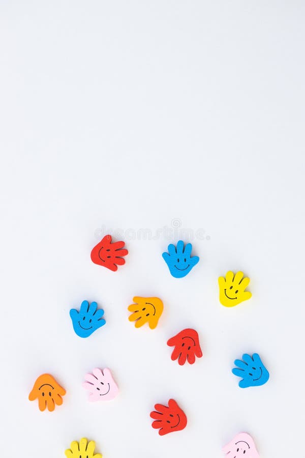 Colored Wooden Figures in the Form Hand with Smiles on a White ...