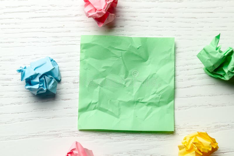 Colored Wrinkled Note Paper on White Wooden Table. Stock Photo - Image ...
