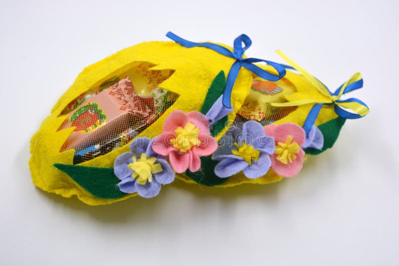 Colored Yellow Packages with Sweets Packed in the Form of an Egg Made ...