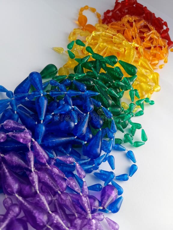Colorful Abstract Beads on Strings in Piles on a White Background Stock ...
