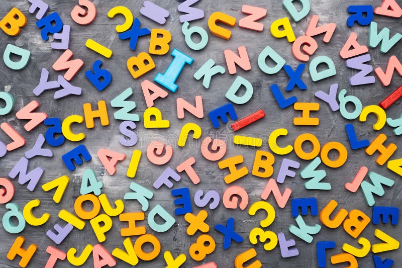 Colorful Alphabet Letters on Gray Background and Texture, Top View ...