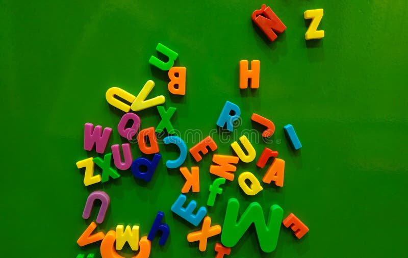 Colorful Alphabet Magnets on a Green Board Stock Image - Image of ...