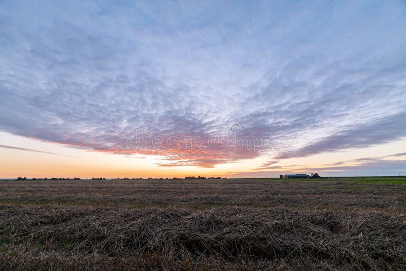 Colorful Altocumulus Clouds Over a Wide Landscape Stock Photo - Image ...