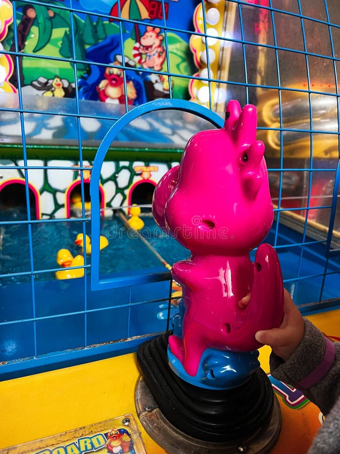 Colorful Arcade Game with Rubber Ducks and Bright Pink Controls Stock ...