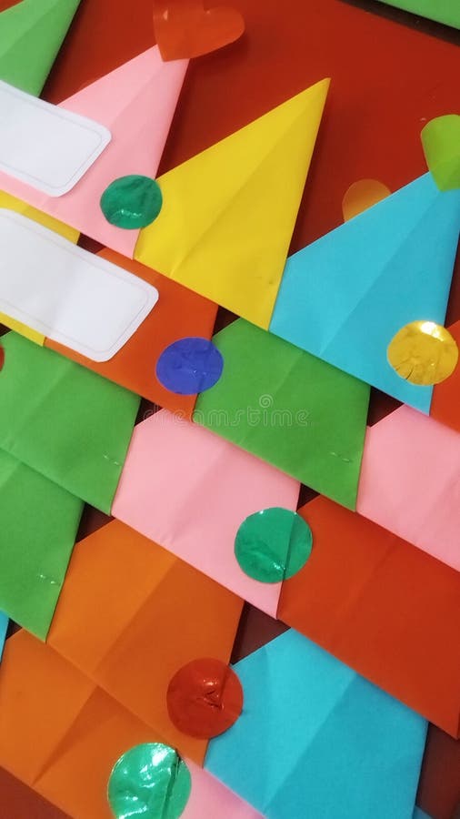 A Colorful Arrangement of Paper Folded and Arranged in a Pattern that ...