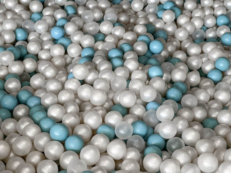 Colorful Arrangement of White and Blue Balls Creating a Playful Texture ...