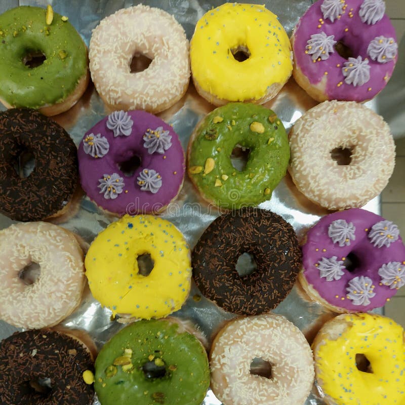 Colorful Assorted Donuts Arranged in a Neat Grid Pattern Stock Image ...