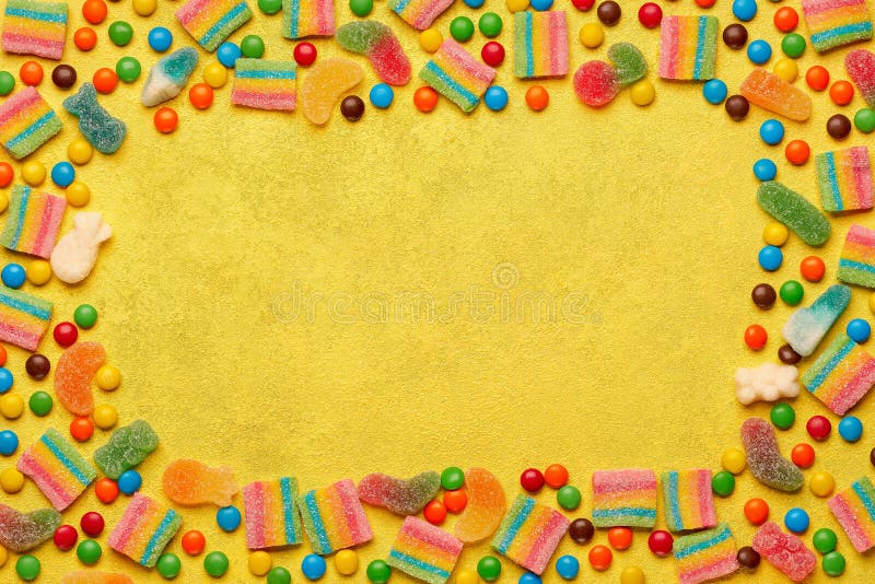Colorful Assortment of Candies in Shape of Frame on Yellow Background ...