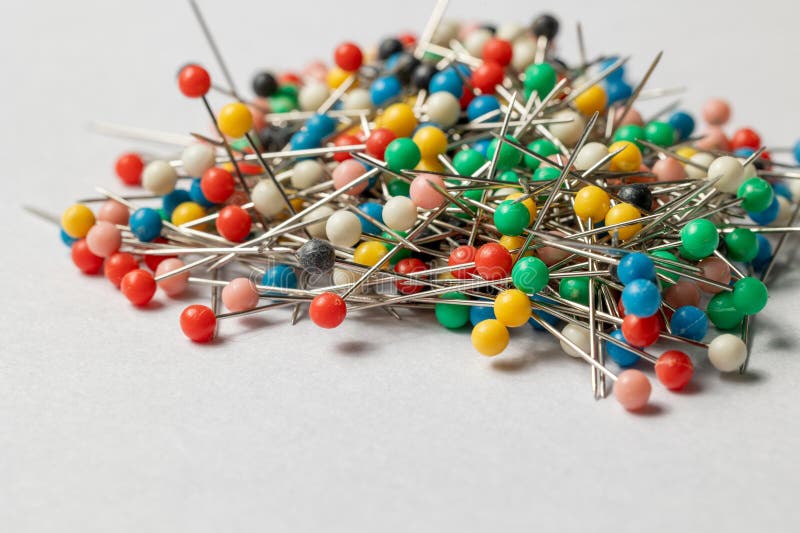 A Colorful Assortment of Push Pins Scattered on a White Surface, Ideal ...