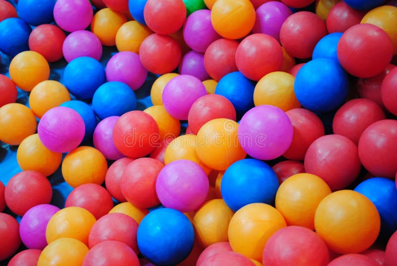 Colorful balls in pool pit stock photo. Image of small - 26611468