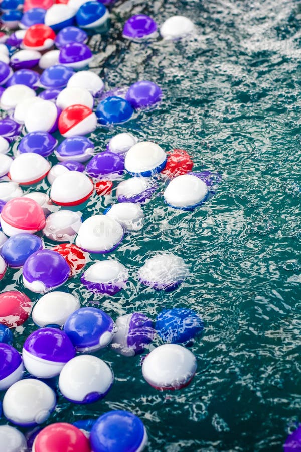 Colorful balls in water stock image. Image of water, playing - 39325325