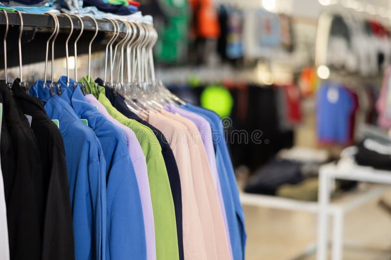 Colorful Basic Shirts Hanging on Stand in Big Clothing Store Stock ...