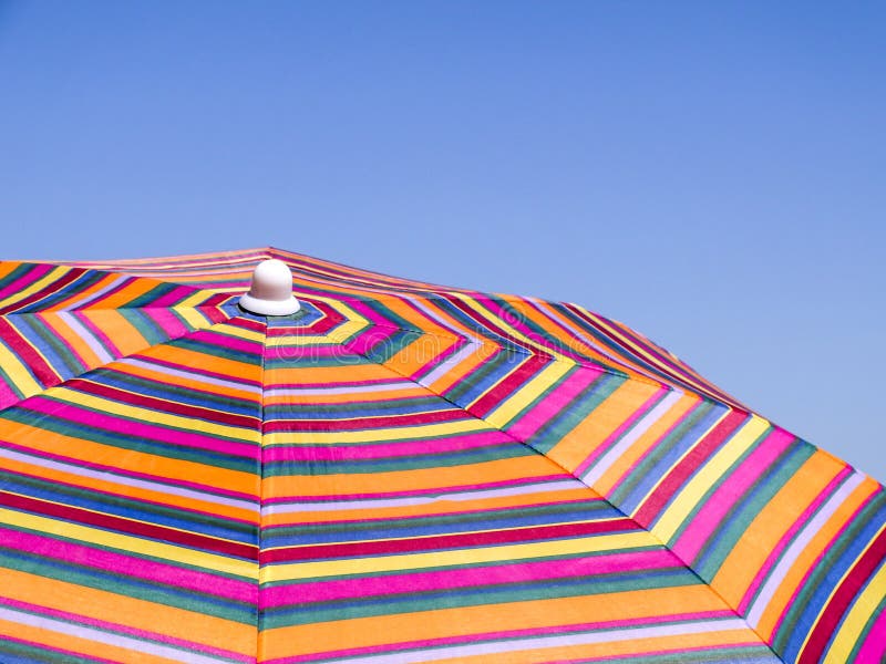 Colorful Beach Umbrella Against the Blue Sky. Striped Texture Stock ...