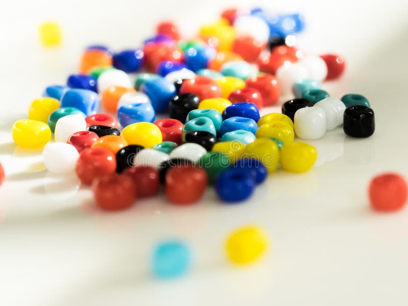 Colorful Plastic Bead Assortment on White Stock Image - Image of ...