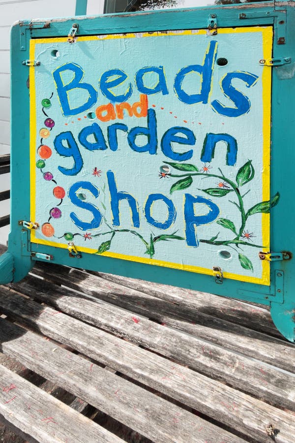 Colorful Beads and Garden Shop Sign Stock Image - Image of colors ...