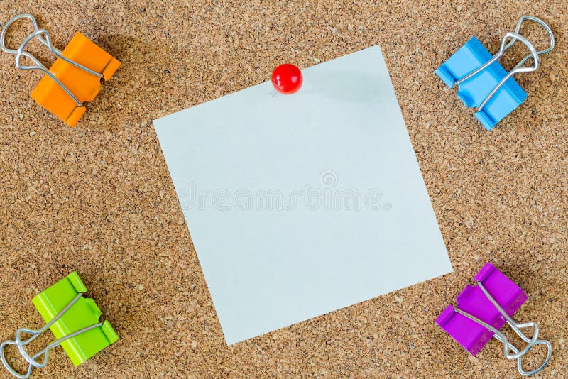 Colorful Binder Clips On Cork Board With Note Stock Photo - Image of ...
