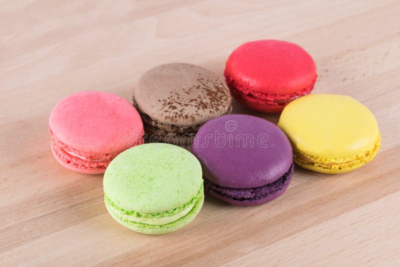 Colorful Biscuits Lie In Two Rows On A Light Wooden Table Stock Image ...
