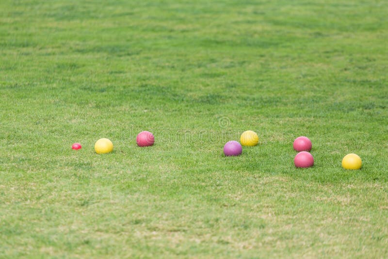Colorful Bocce Balls in Green Lawn Stock Photo - Image of balls, purple ...