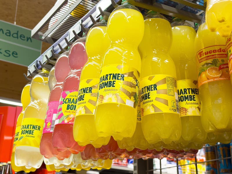 Colorful Bottled Beverages on Display Shelf in Supermarket Aisle ...