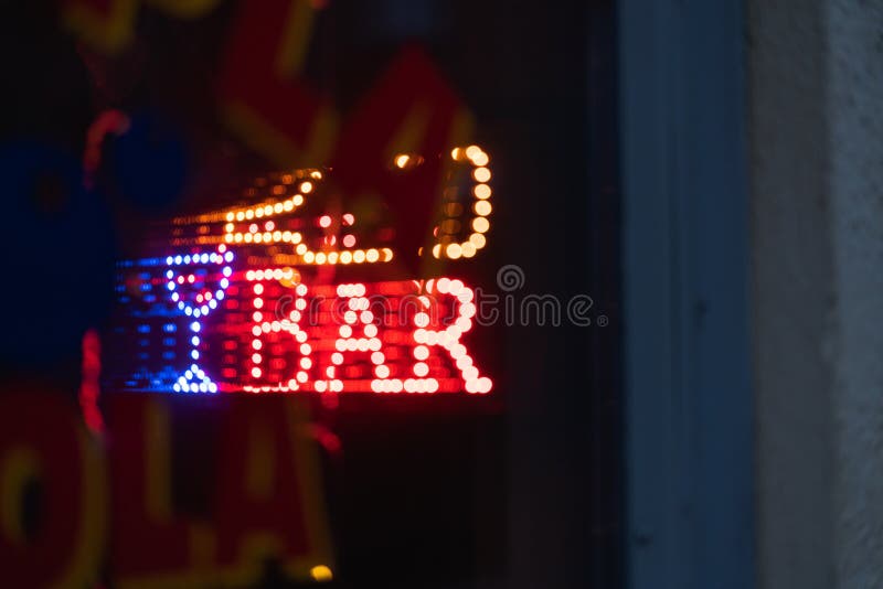 Colorful Bright Lit Sign of a Bar at Night Stock Image - Image of ...