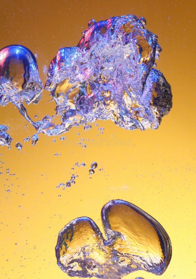 Golden Amber Water Drops stock image. Image of drink, shape - 4683827