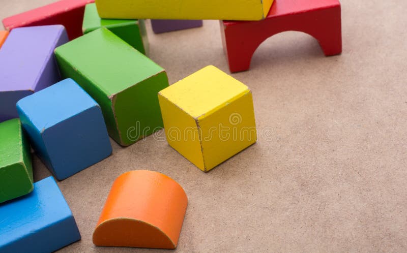 Colorful Building Blocks on Brown Background Stock Photo - Image of ...