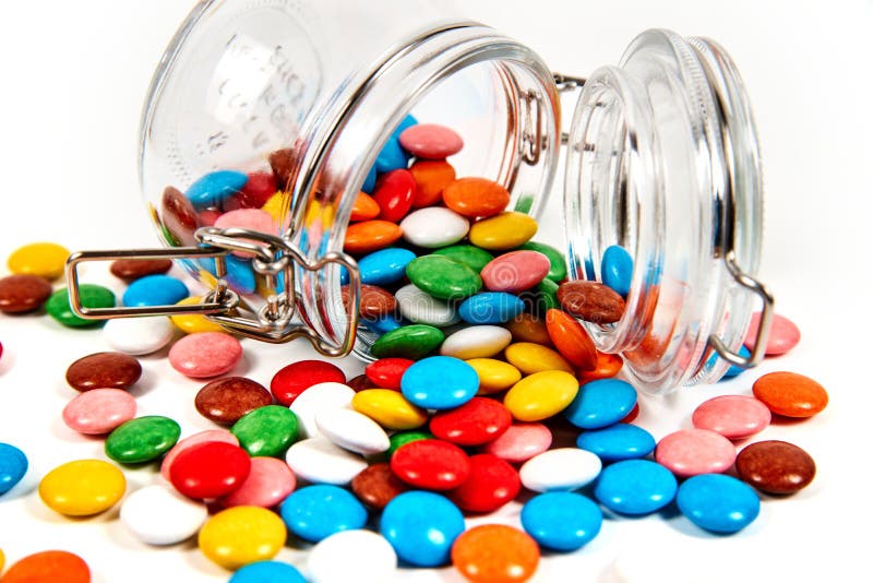 Colorful Candies in Glass Jar Scattered Isolated on White Stock Image ...
